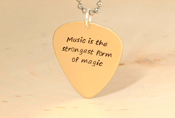 Music is the strongest form of magic bronze guitar pick necklace – Nici ...