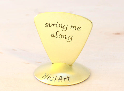 String me Along Triangular Brass Guitar Pick – Nici's Picks